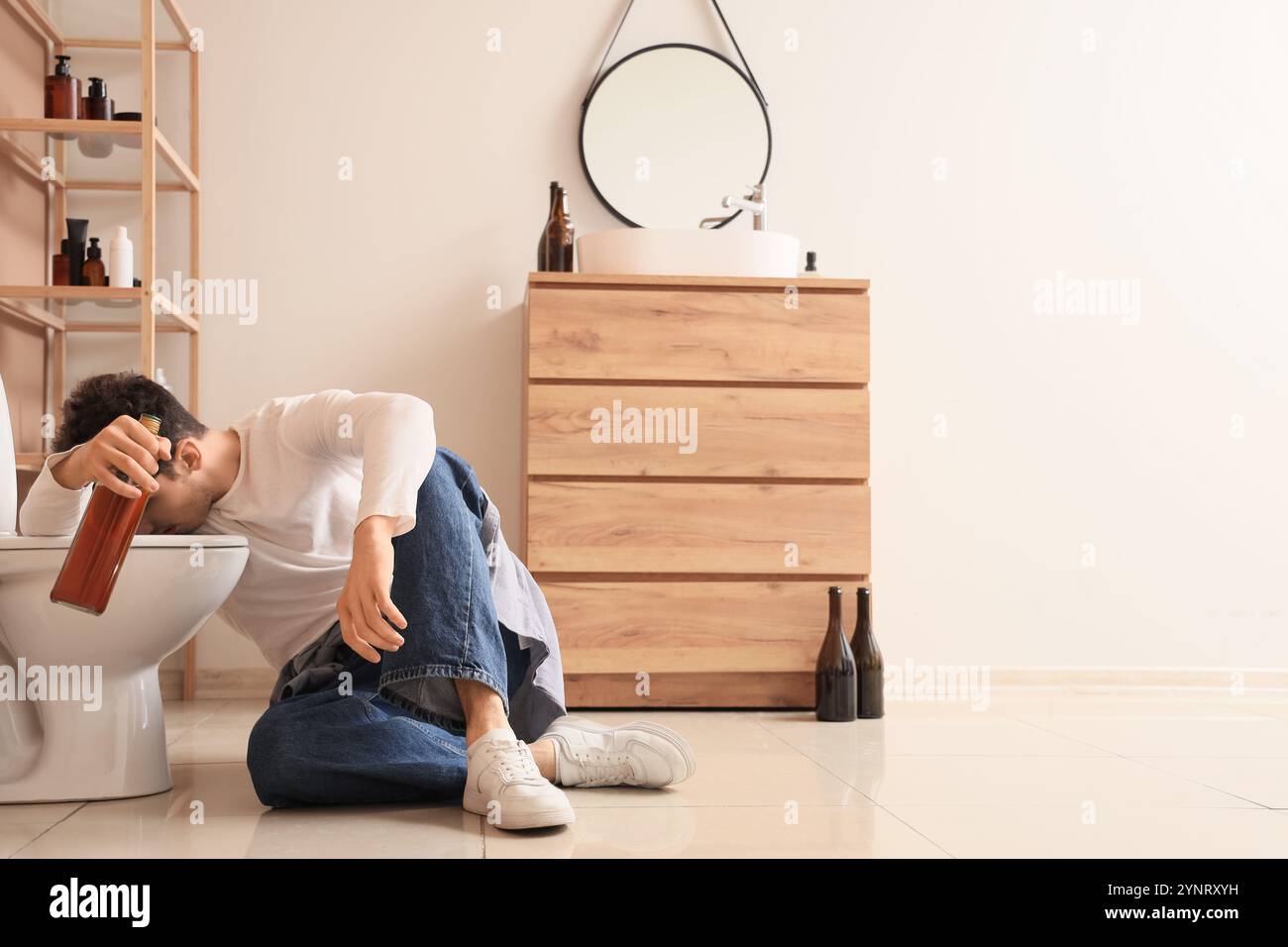 Sick young man with hangover near toilet bowl. Alcoholism concept Stock ...