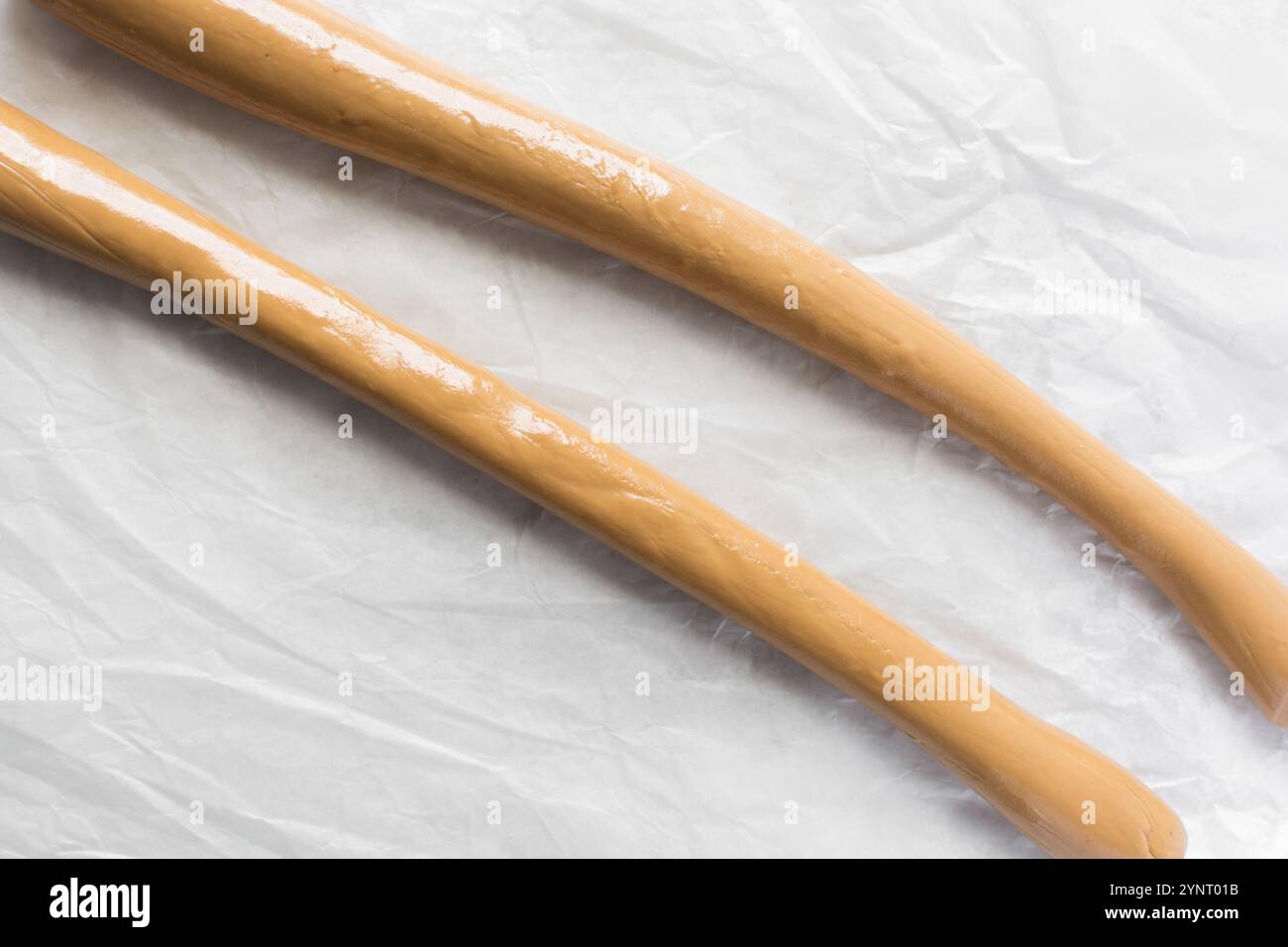 Overhead view of iloka candy on parchment paper, top view of cooked ...