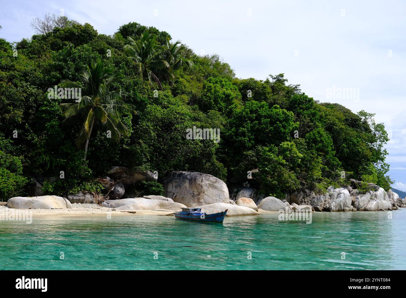 Indonesia Anambas Islands - Dinkor Island with fishing boat and large ...