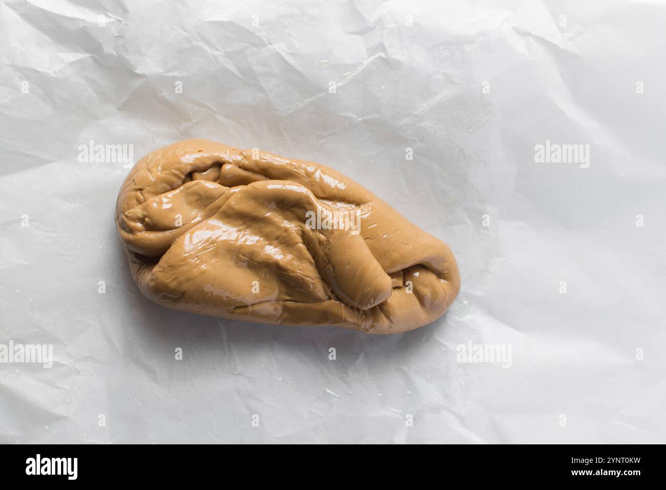 Overhead view of iloka candy on parchment paper, top view of cooked ...