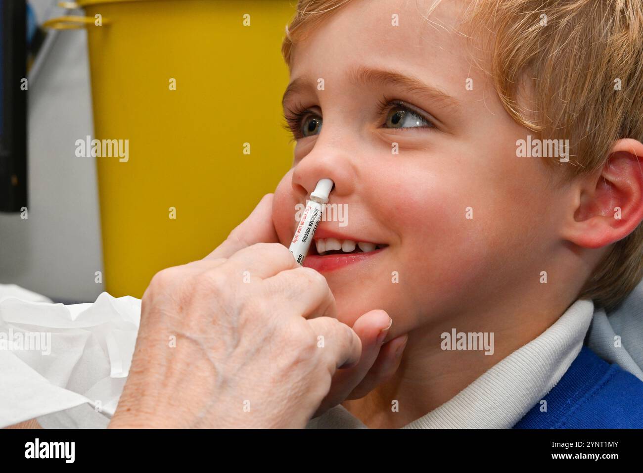 Editorial use only Child receiving the 2024/2025 northern hemisphere ...