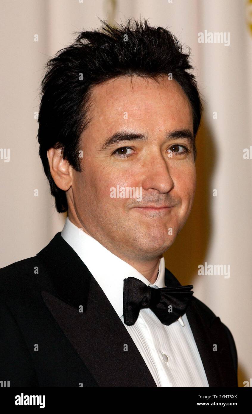 HOLLYWOOD, CA: Presenter John Cusack onstage in the Press Room at the ...