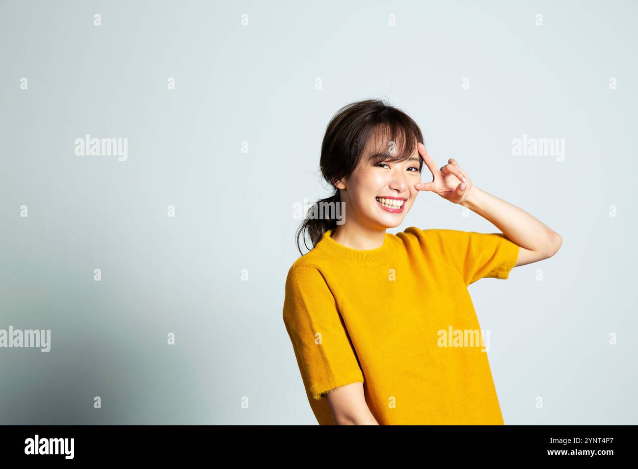 Businesswoman making peace sign hi-res stock photography and images - Alamy