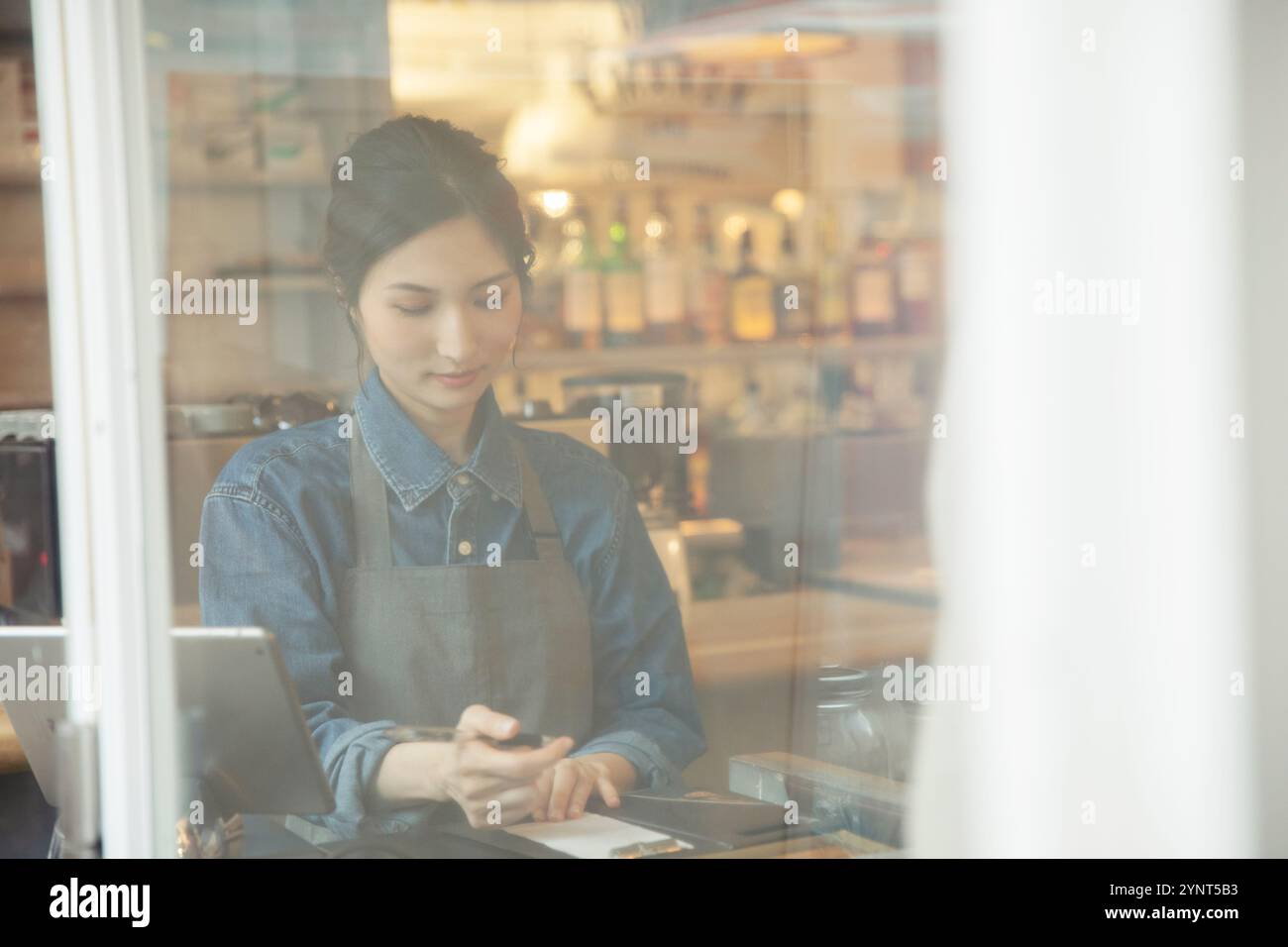 Female cafe worker Stock Photo - Alamy