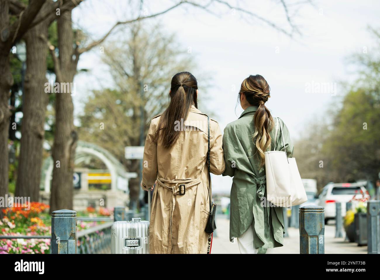 Back view curly woman walking hi-res stock photography and images - Alamy
