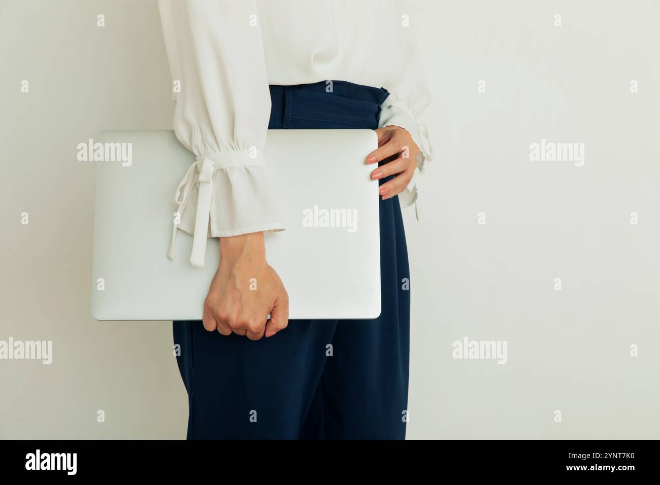 Laptop in hand hi-res stock photography and images - Alamy