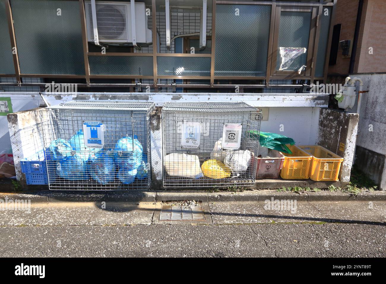 Rubbish storage area in a housing complex Stock Photo - Alamy