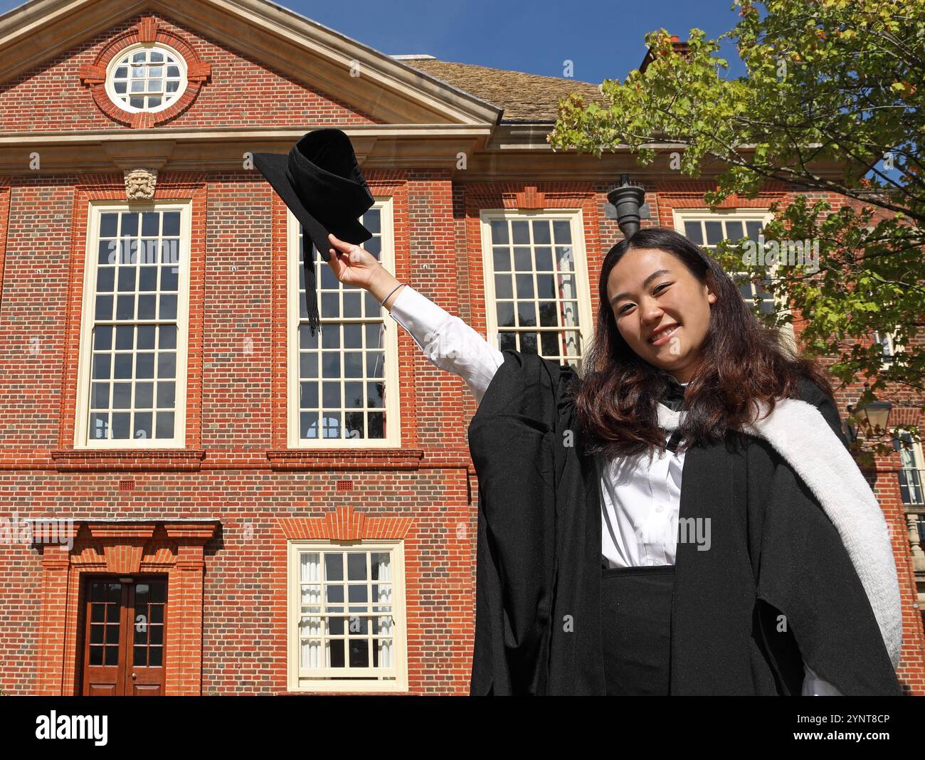 Oxford University College and a Japanese woman at graduation ceremony ...