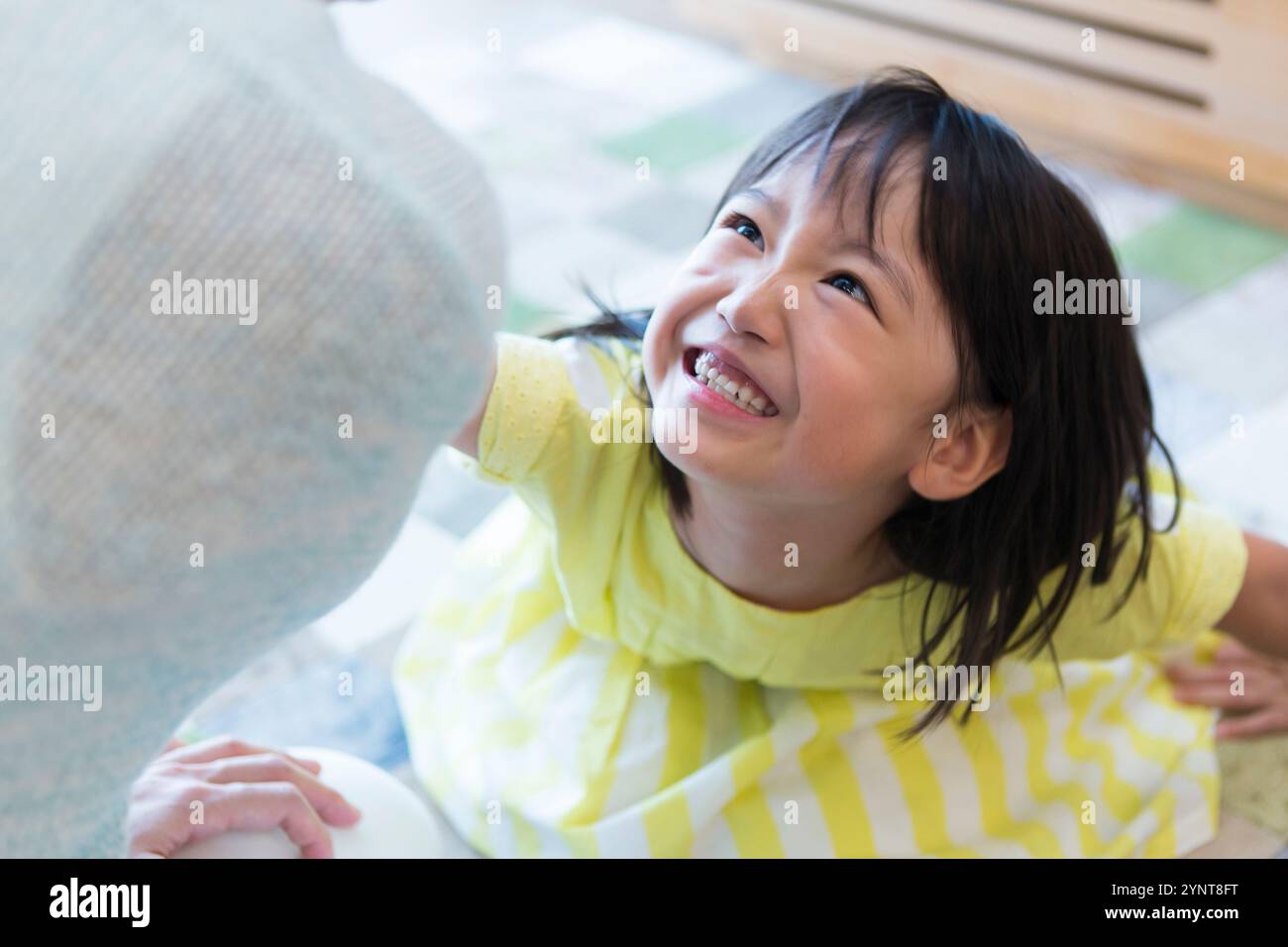 Parents and children doing a finger-slicing manoeuvre Stock Photo - Alamy