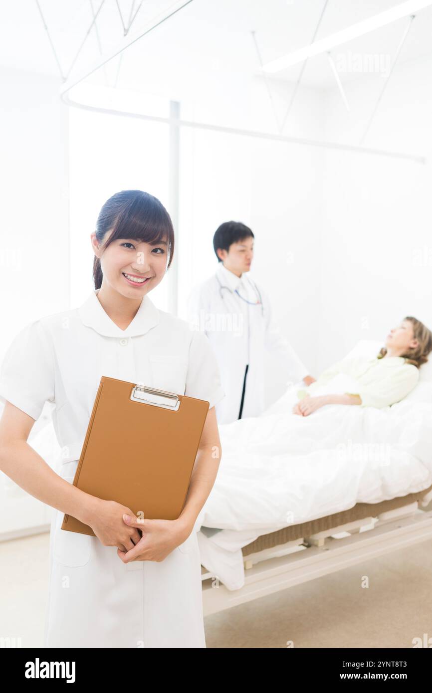Nurse standing facing front Stock Photo - Alamy