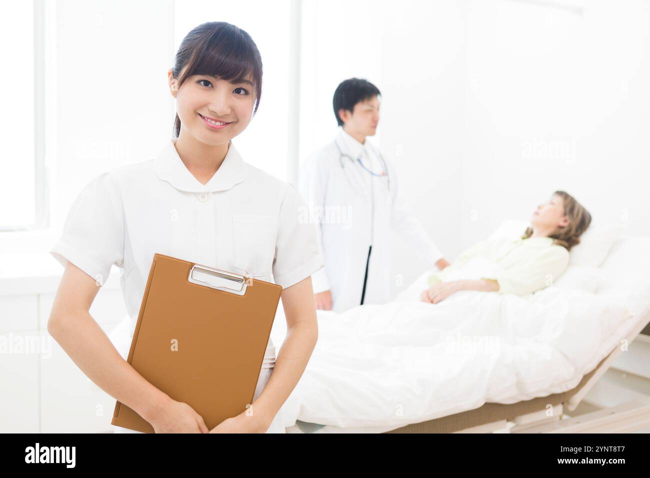 Nurse standing facing front Stock Photo - Alamy