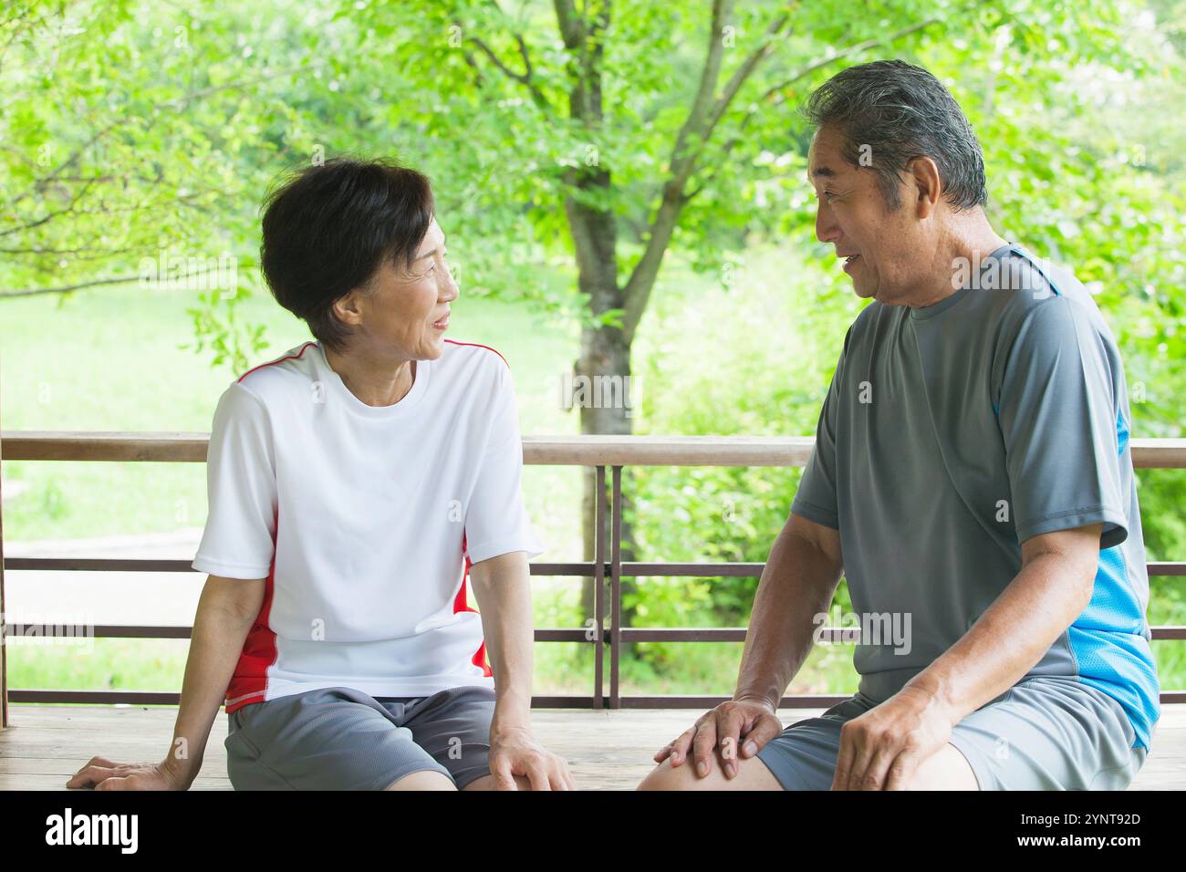 Senior citizen sitting on bench Stock Photo - Alamy