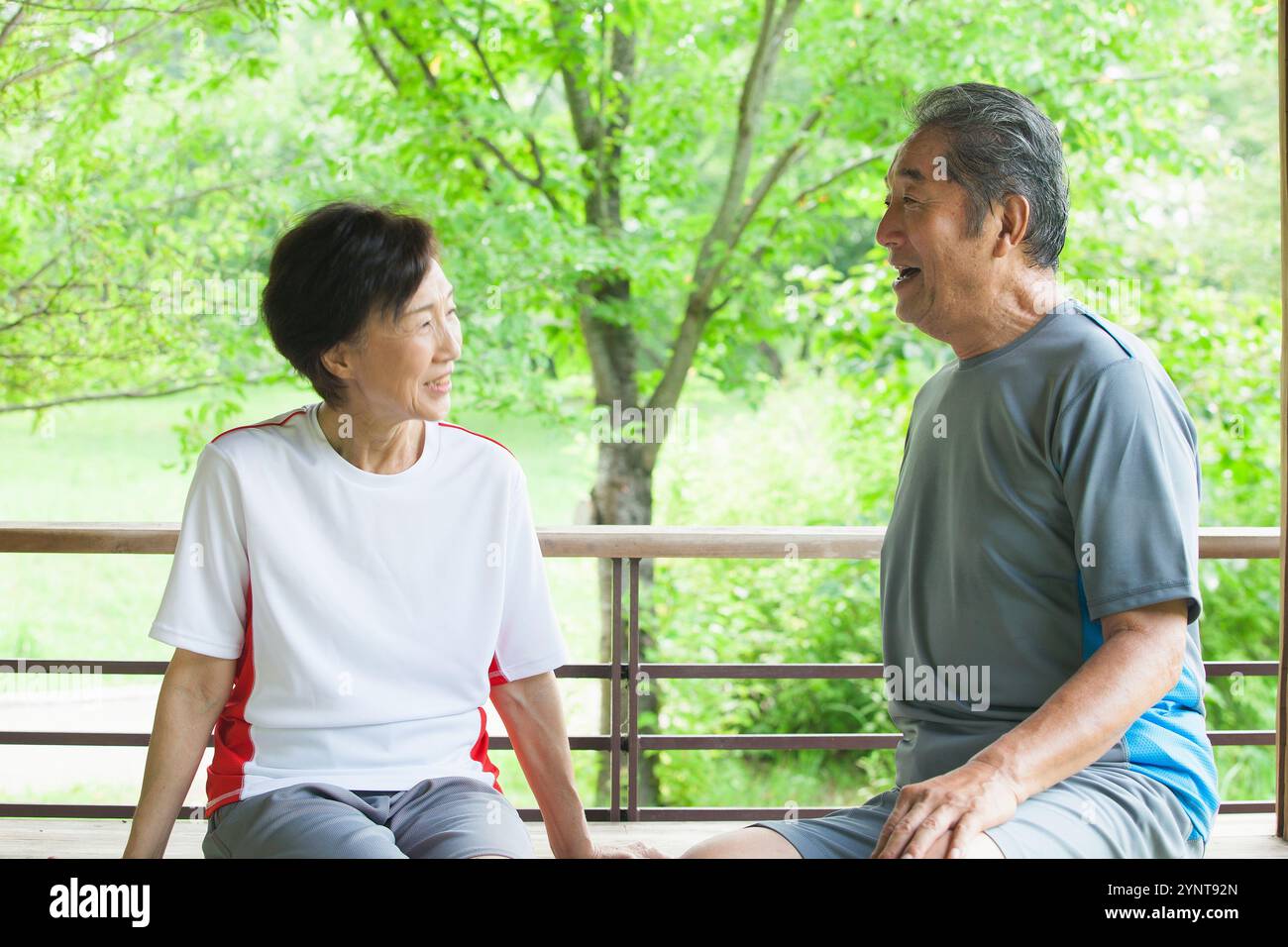 Senior citizen sitting on bench Stock Photo - Alamy