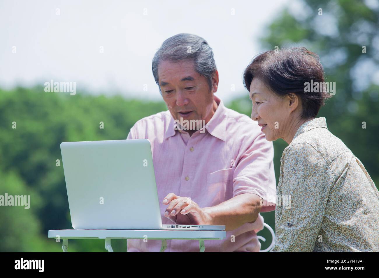 Senior citizen playing computer Stock Photo - Alamy