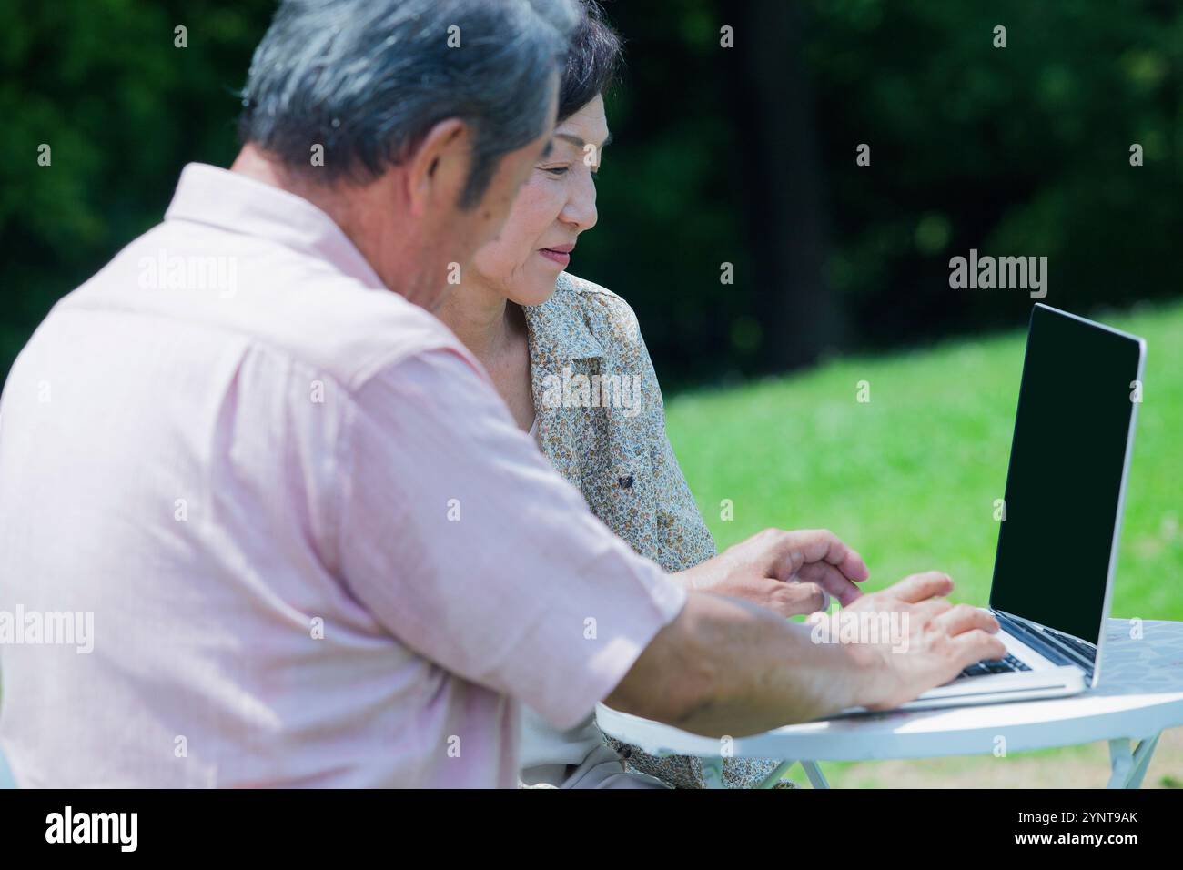 Senior citizen playing computer Stock Photo - Alamy