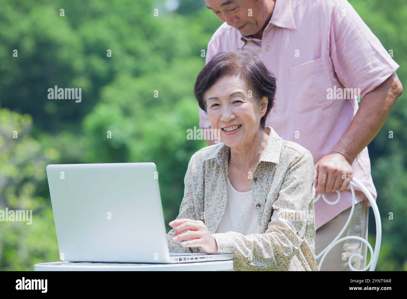 Senior citizen playing computer Stock Photo - Alamy