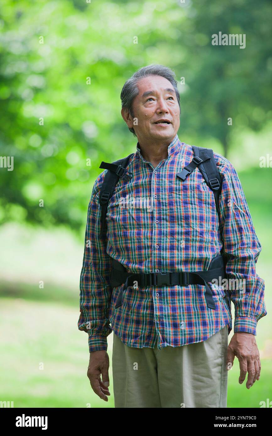 With rucksack on one shoulder hi-res stock photography and images - Alamy