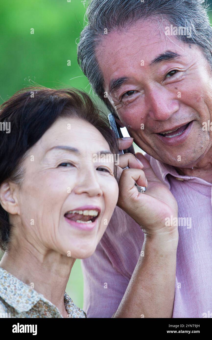 Senior citizen making a phone call Stock Photo - Alamy