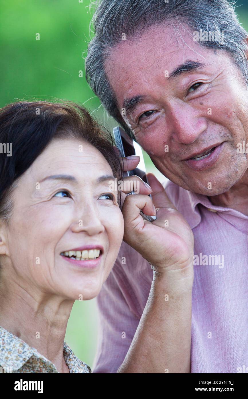 Senior citizen making a phone call Stock Photo - Alamy