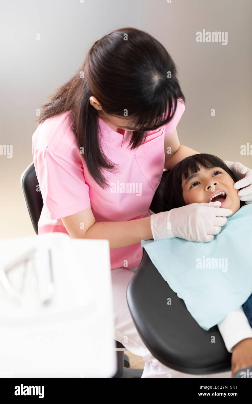 Girl undergoing dental check-up Stock Photo - Alamy