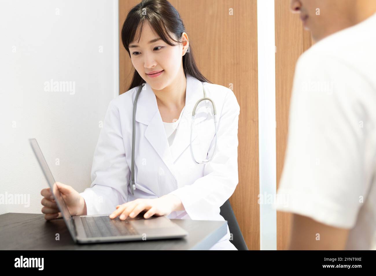 Female doctor showing test results Stock Photo - Alamy