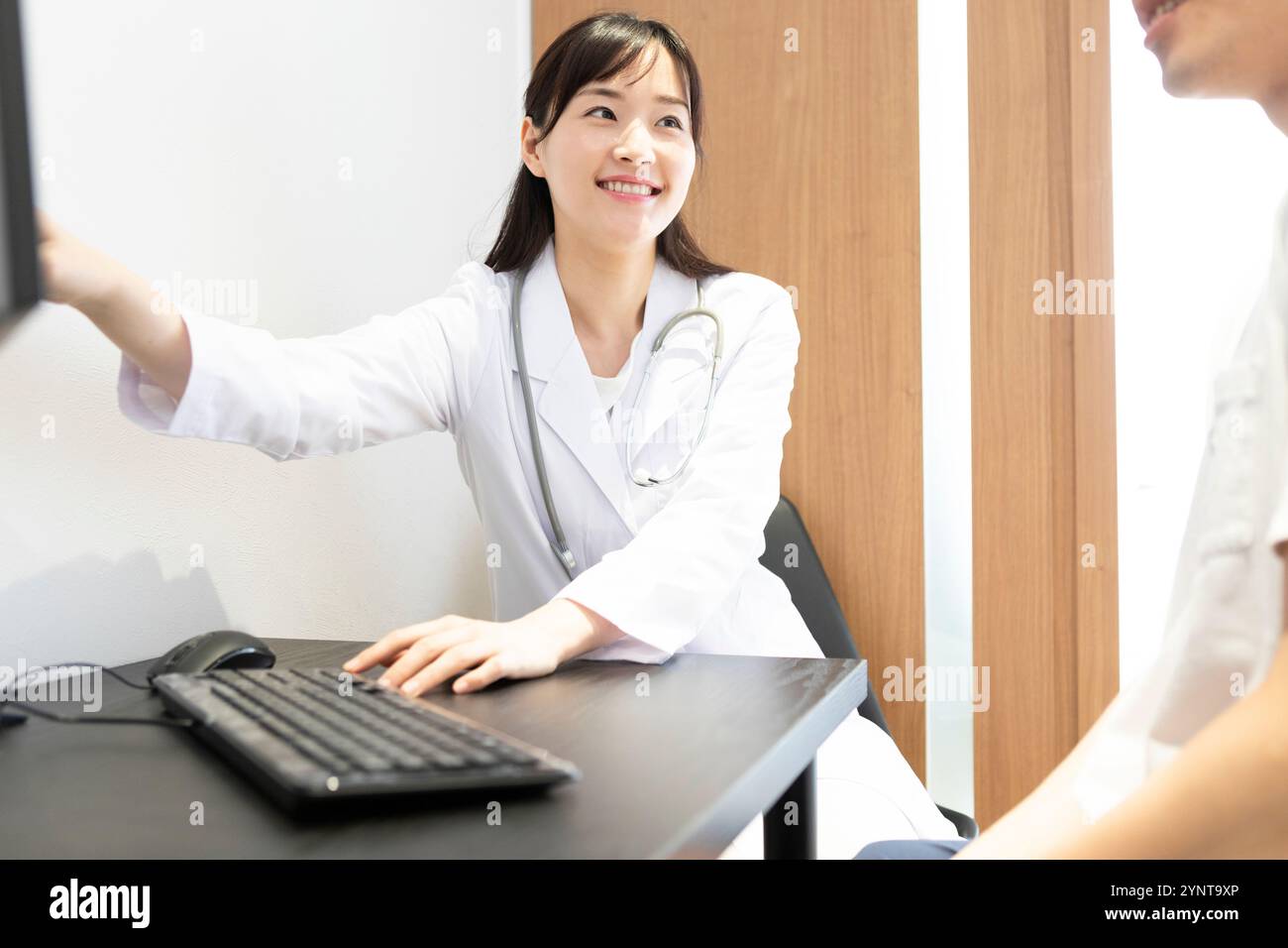 Female doctor showing test results Stock Photo - Alamy