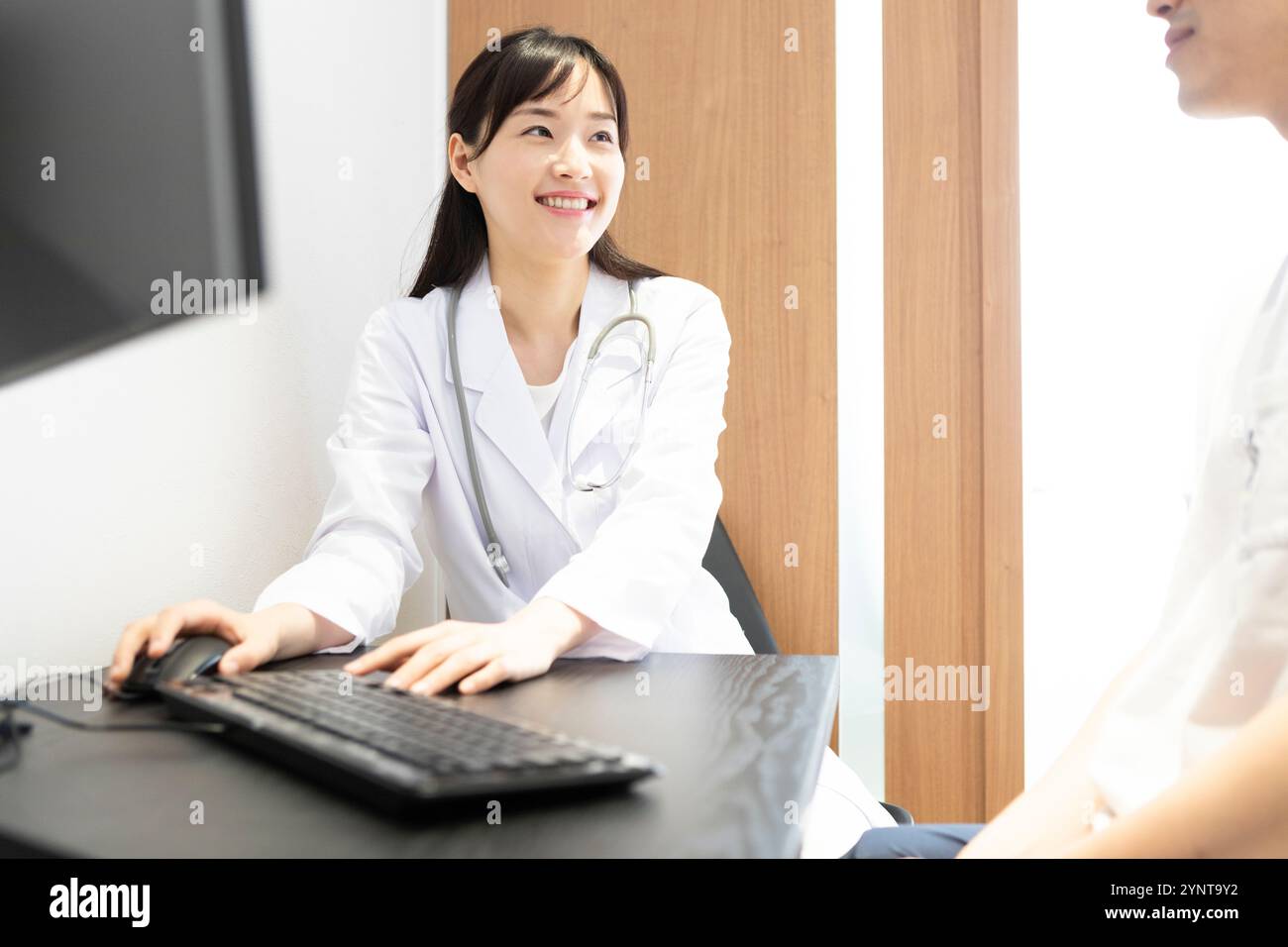 Female doctor showing test results Stock Photo - Alamy