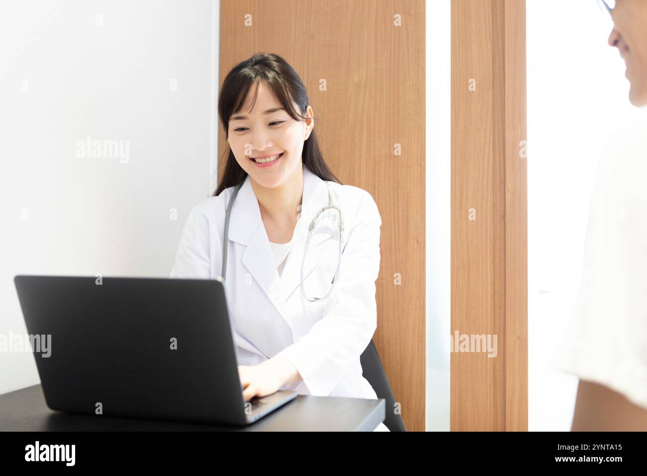 Doctor typing patient hi-res stock photography and images - Alamy