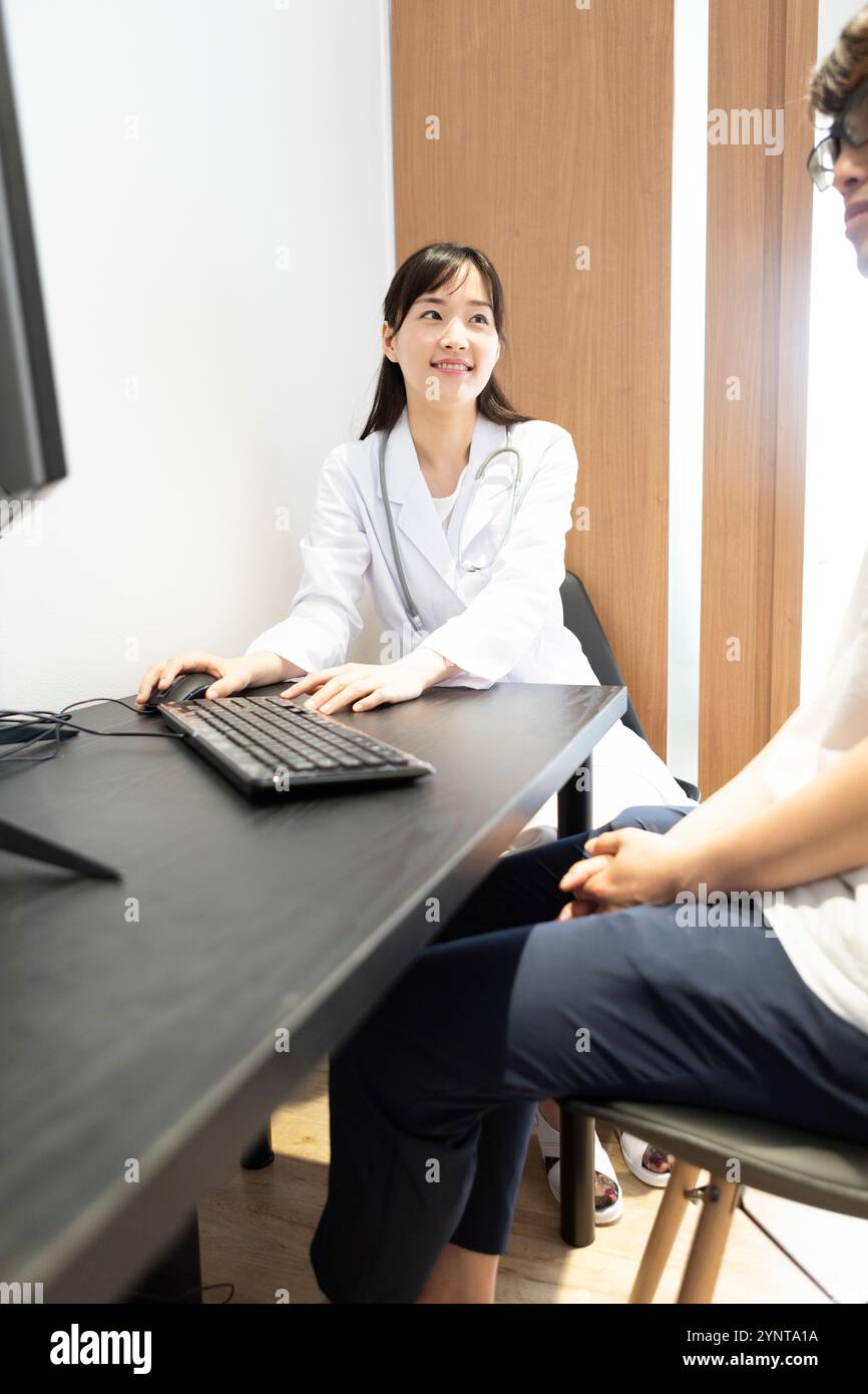 Female doctor showing test results Stock Photo - Alamy