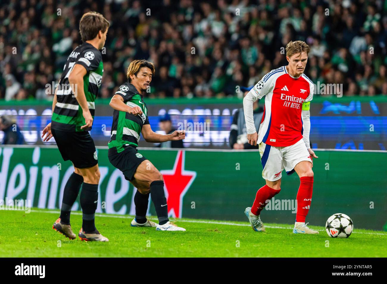 Lisbon, Portugal. 26th Nov, 2024. Martin Odegaard (R) of Arsenal seen ...