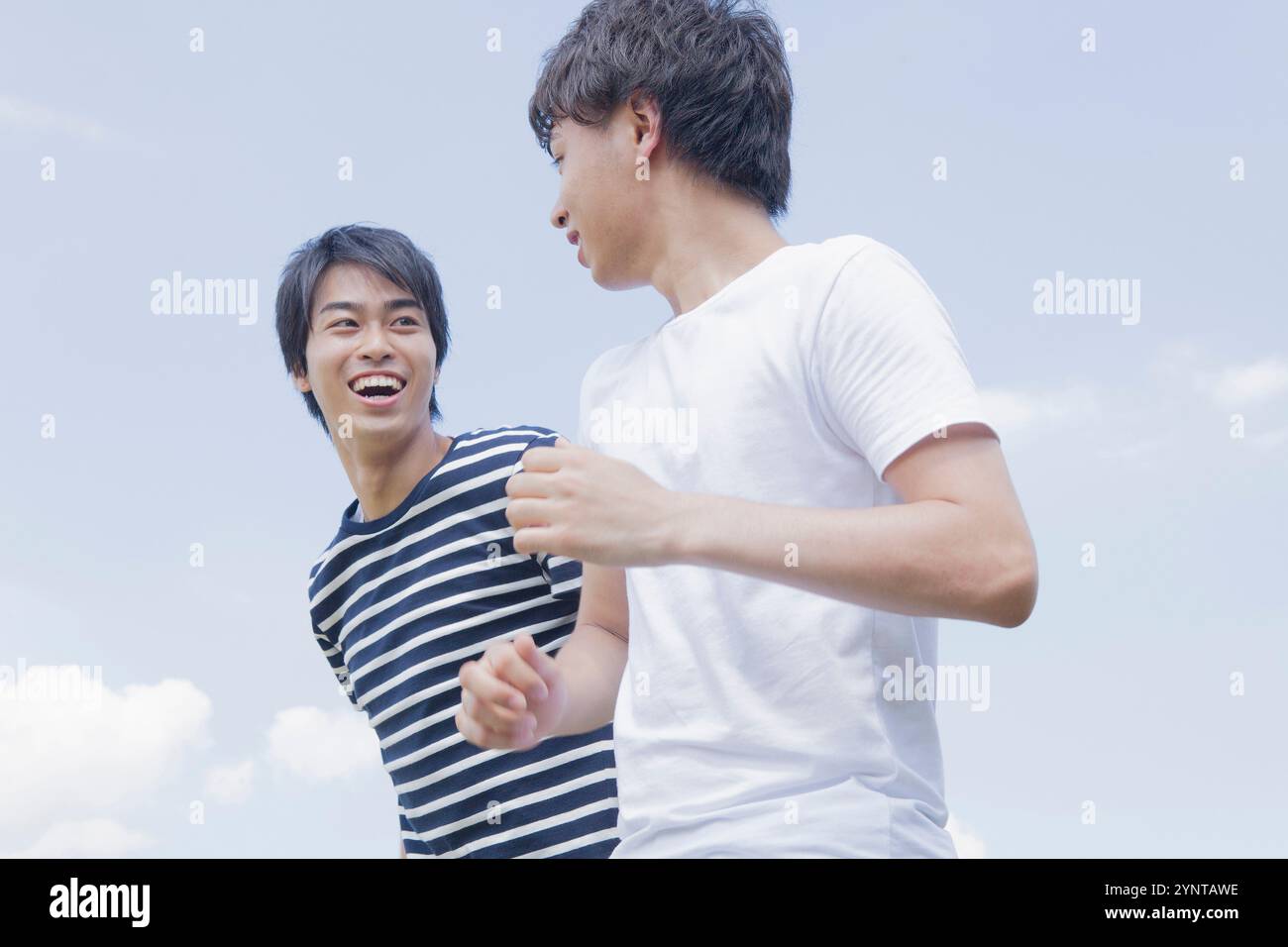 Running male student Stock Photo - Alamy