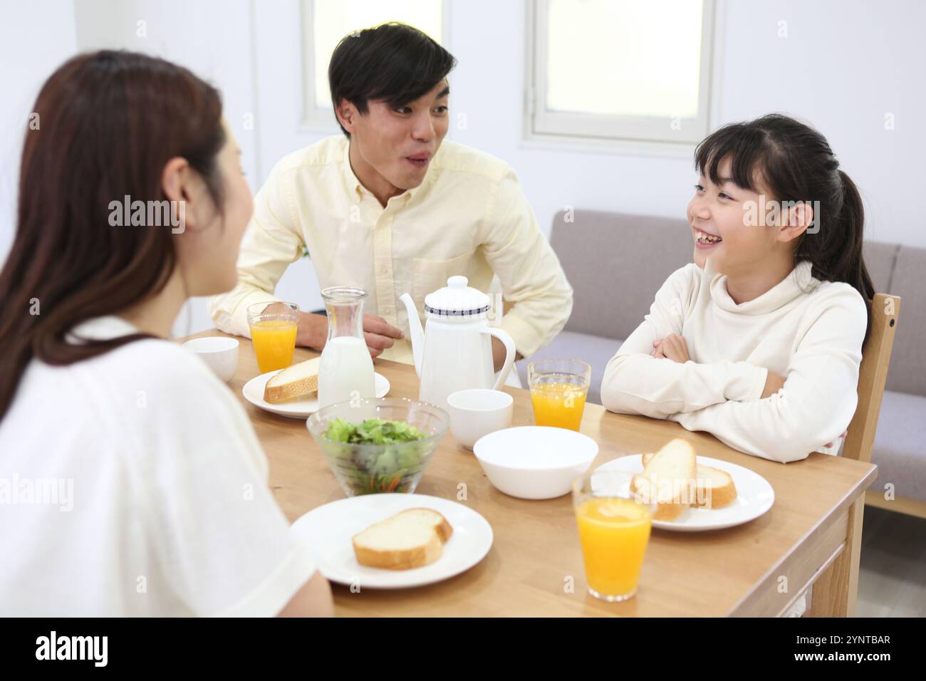Family eating breakfast Stock Photo - Alamy