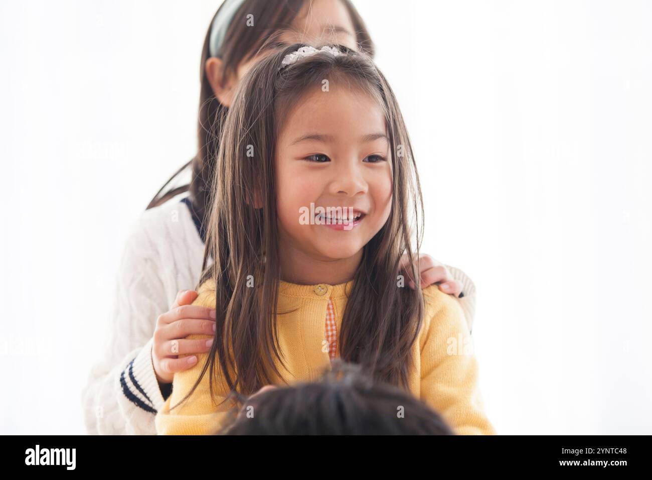 Father putting his child on his back Stock Photo - Alamy