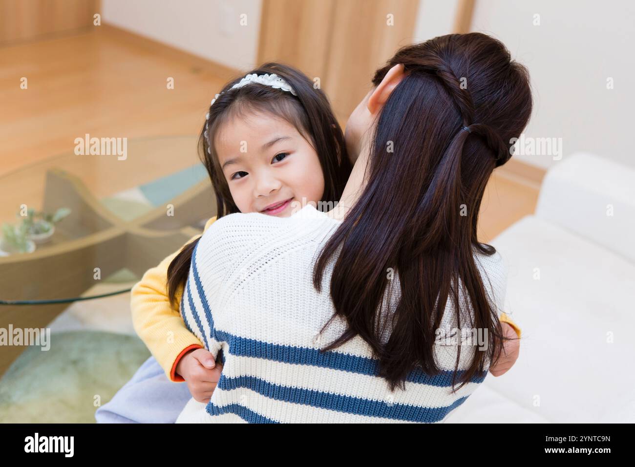 Baby girl being pampered by her mother Stock Photo - Alamy