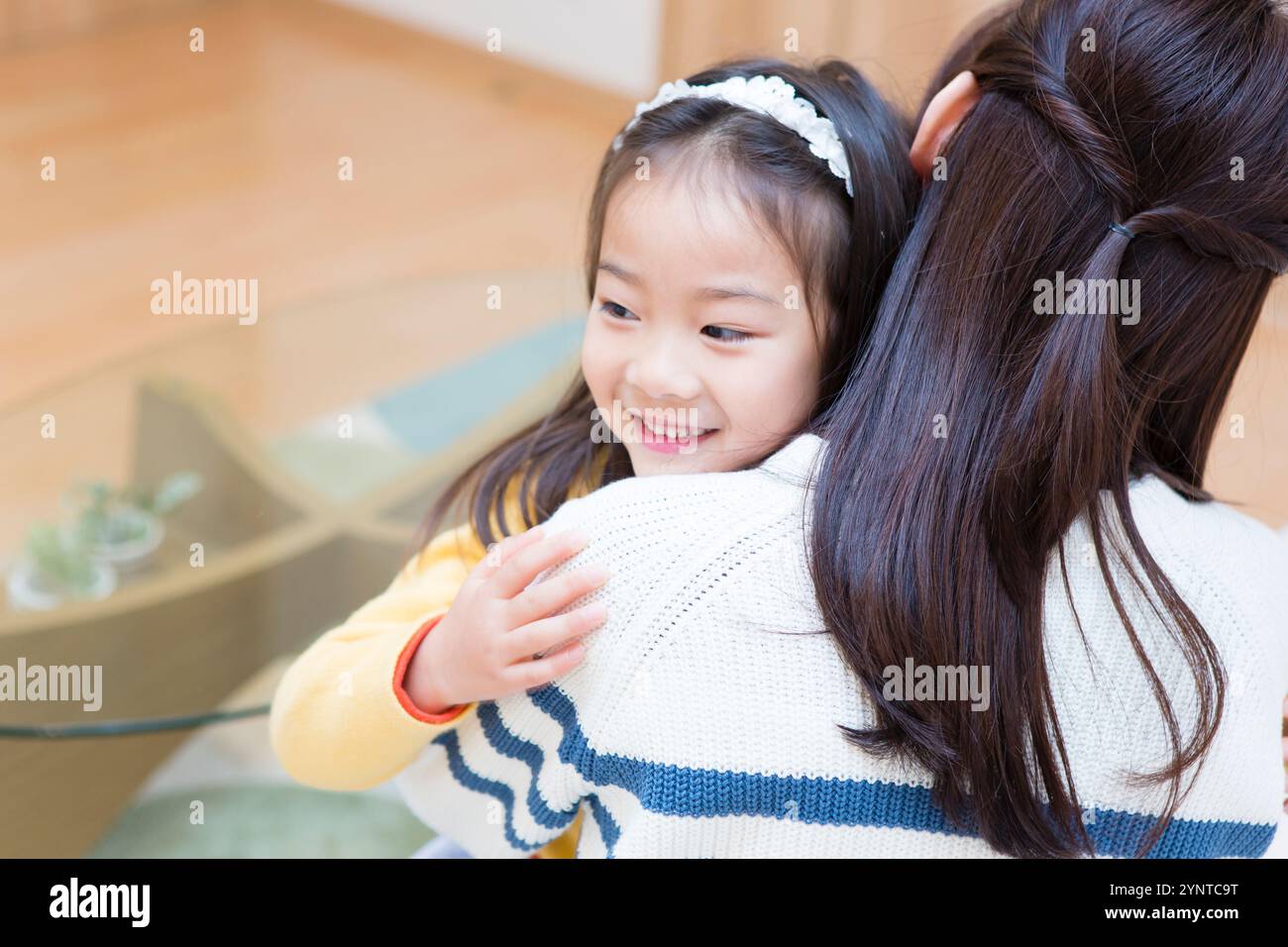 Baby girl being pampered by her mother Stock Photo - Alamy