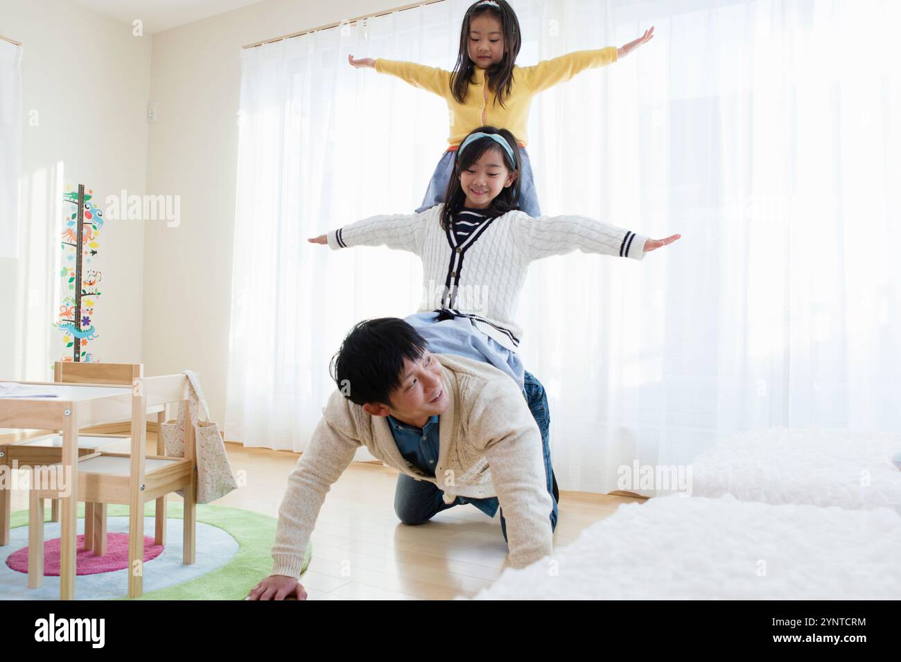 Father putting his child on his back Stock Photo - Alamy