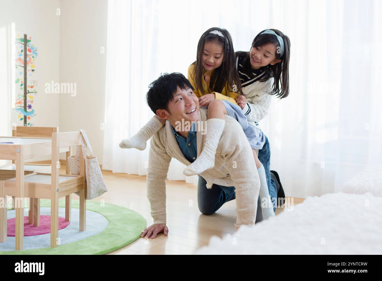 Father putting his child on his back Stock Photo - Alamy