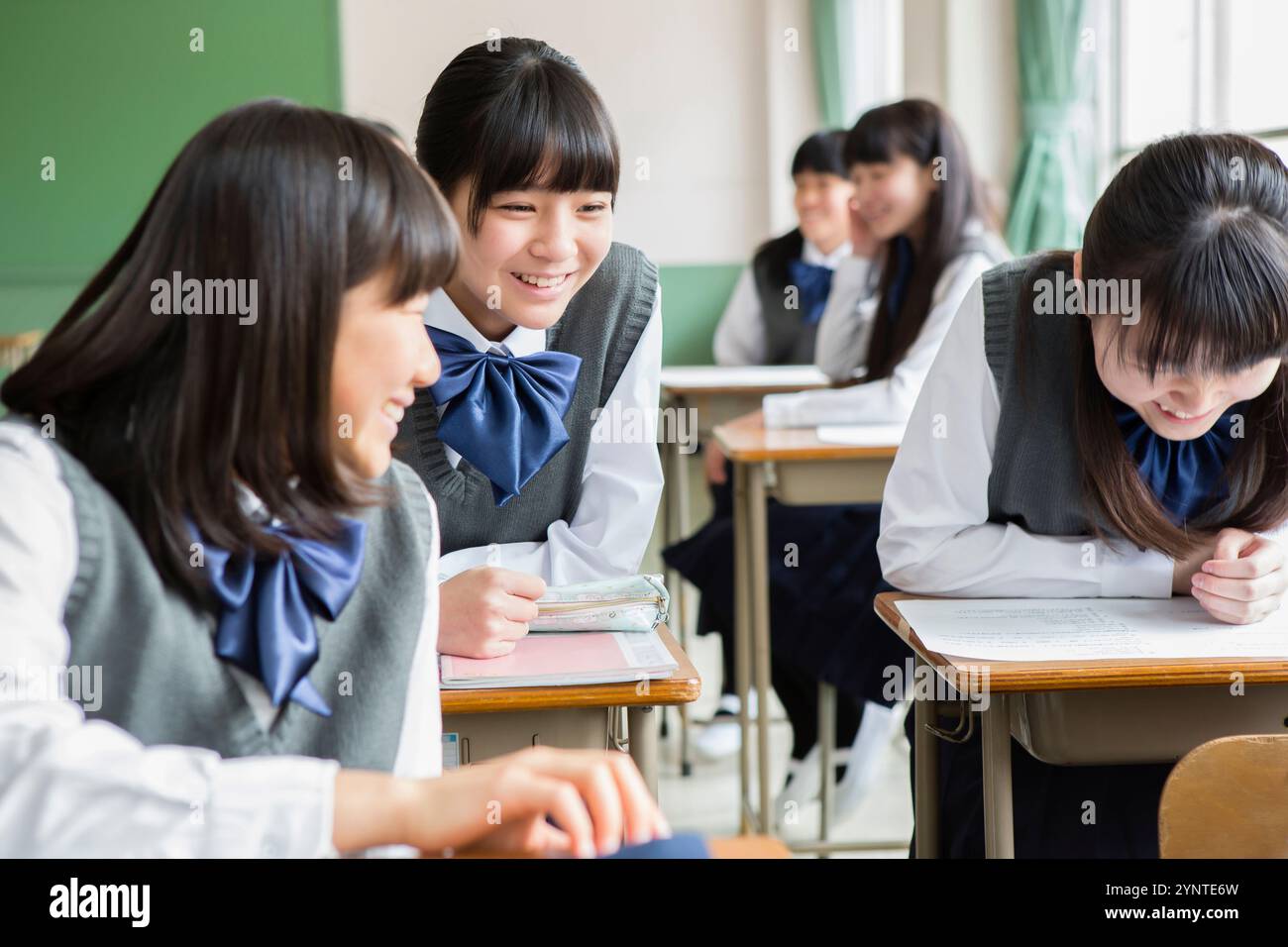 Female students discussing lesson hi-res stock photography and images ...
