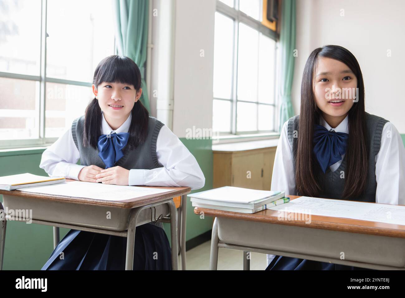 Female students discussing lesson hi-res stock photography and images ...