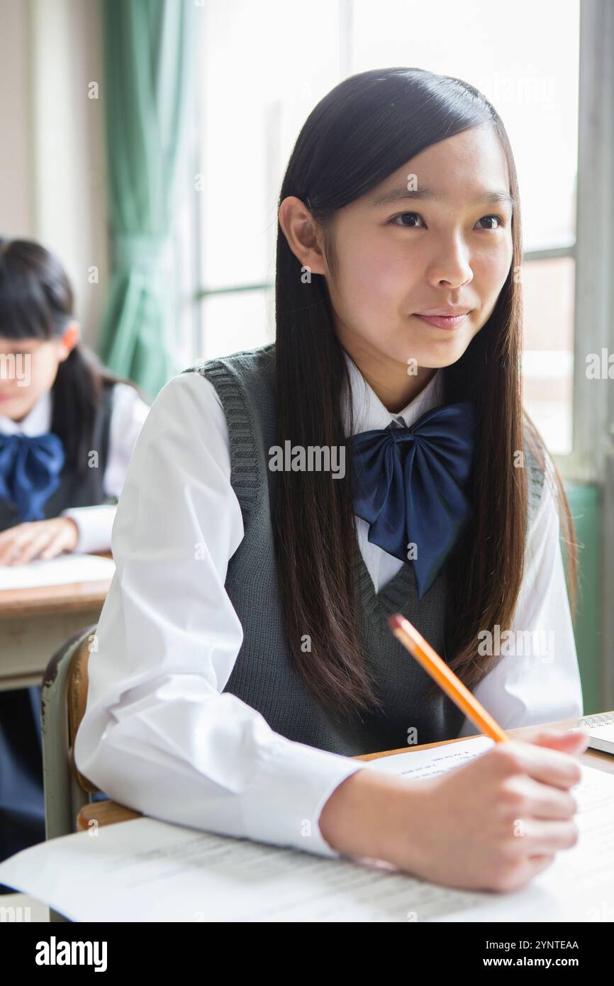 Female students in class Stock Photo - Alamy