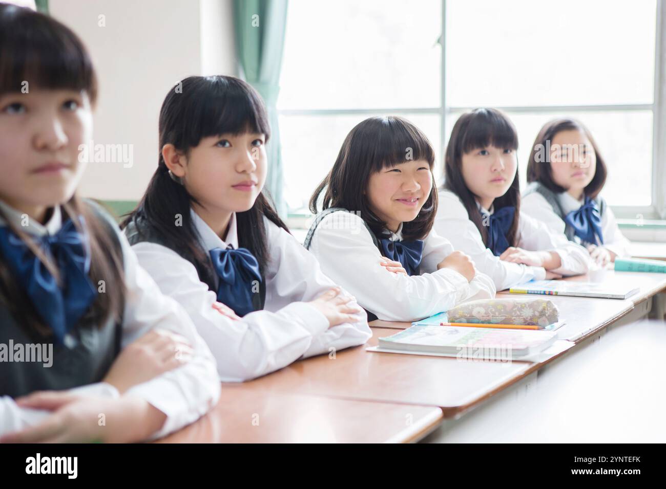 Female student sitting in classroom Stock Photo - Alamy