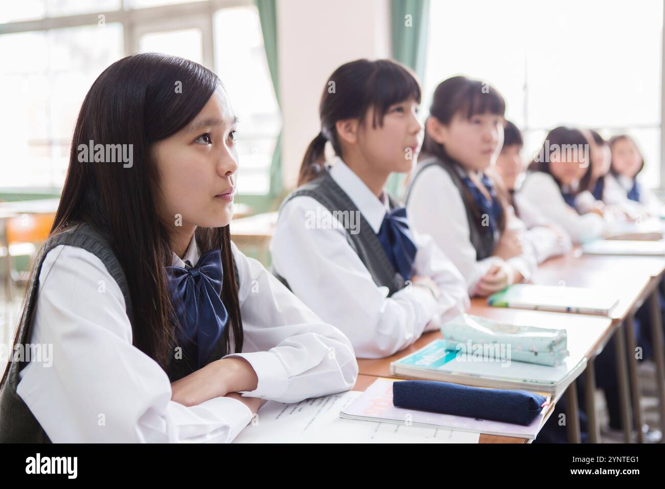 Female student sitting in classroom Stock Photo - Alamy
