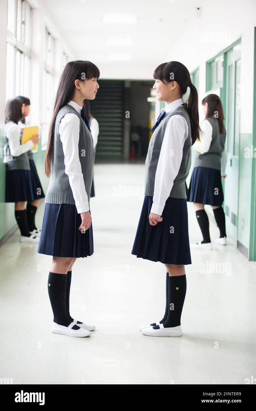 Students standing opposite each other Stock Photo - Alamy