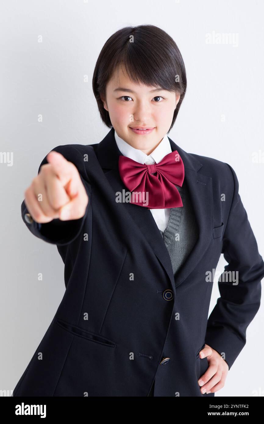 High school girl pointing finger Stock Photo - Alamy