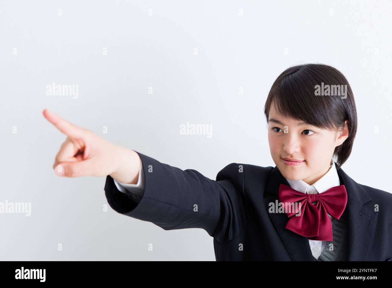High school girl pointing finger Stock Photo - Alamy