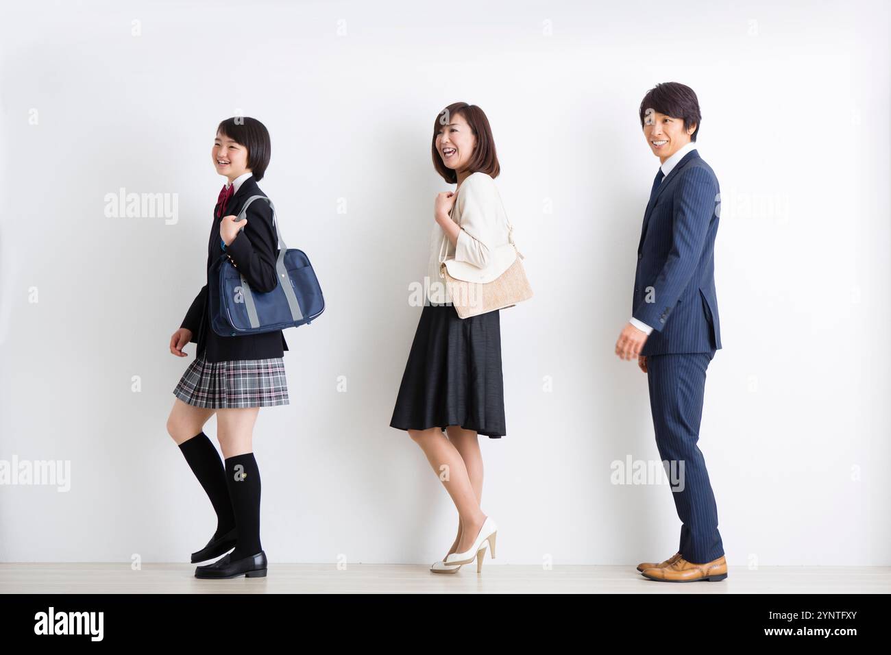 Family in line Stock Photo - Alamy