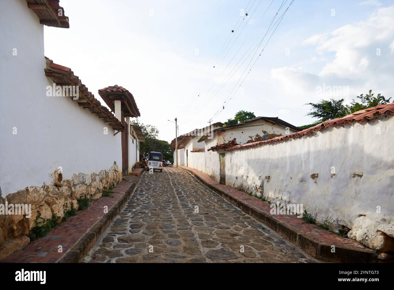Guane, Santander, Colombia; November 26, 2022: Cobblestone street with ...