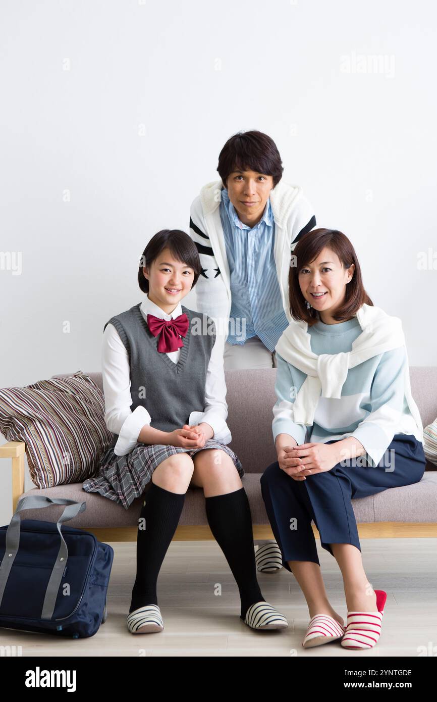 Family grouping together in a room Stock Photo - Alamy