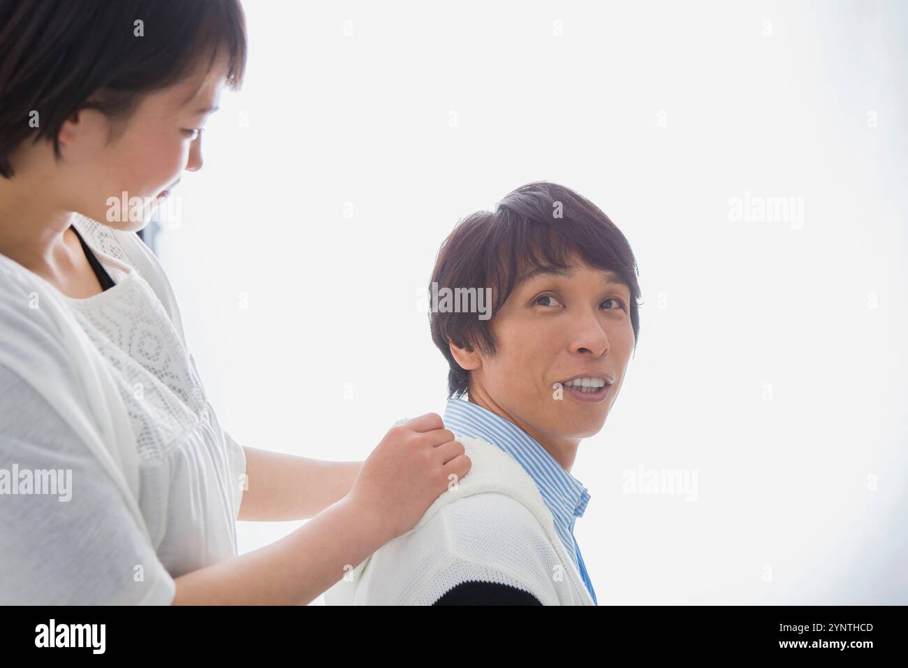 Daughter tapping her father on the shoulder Stock Photo - Alamy
