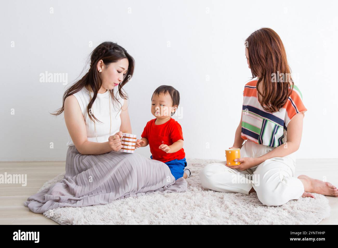Mum and child relaxing in room Stock Photo - Alamy